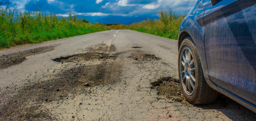 Pothole Damage To Your Car – What Should You Do? - Otago Car Removal